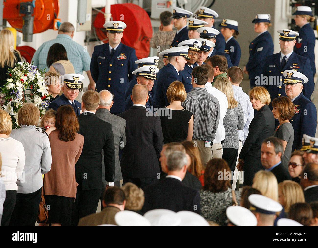 Coast Guard officials, including Adm. Robert J. Papp Jr., left, and ...