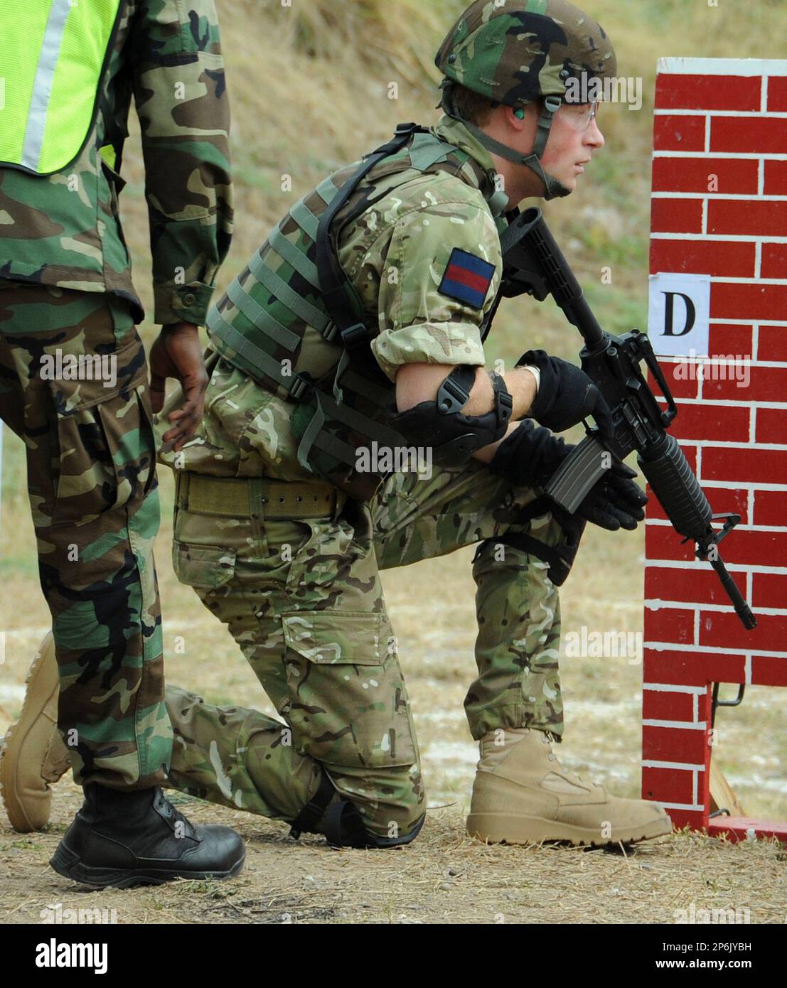 Britain's Prince Harry holds a M4 rifle during a target practice at ...