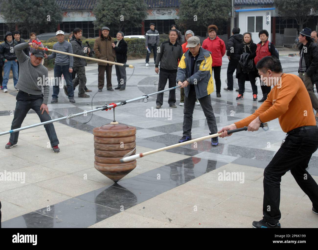 A 338-jin-weight huge spinning top is on running test in Wuhan, Hubei ...
