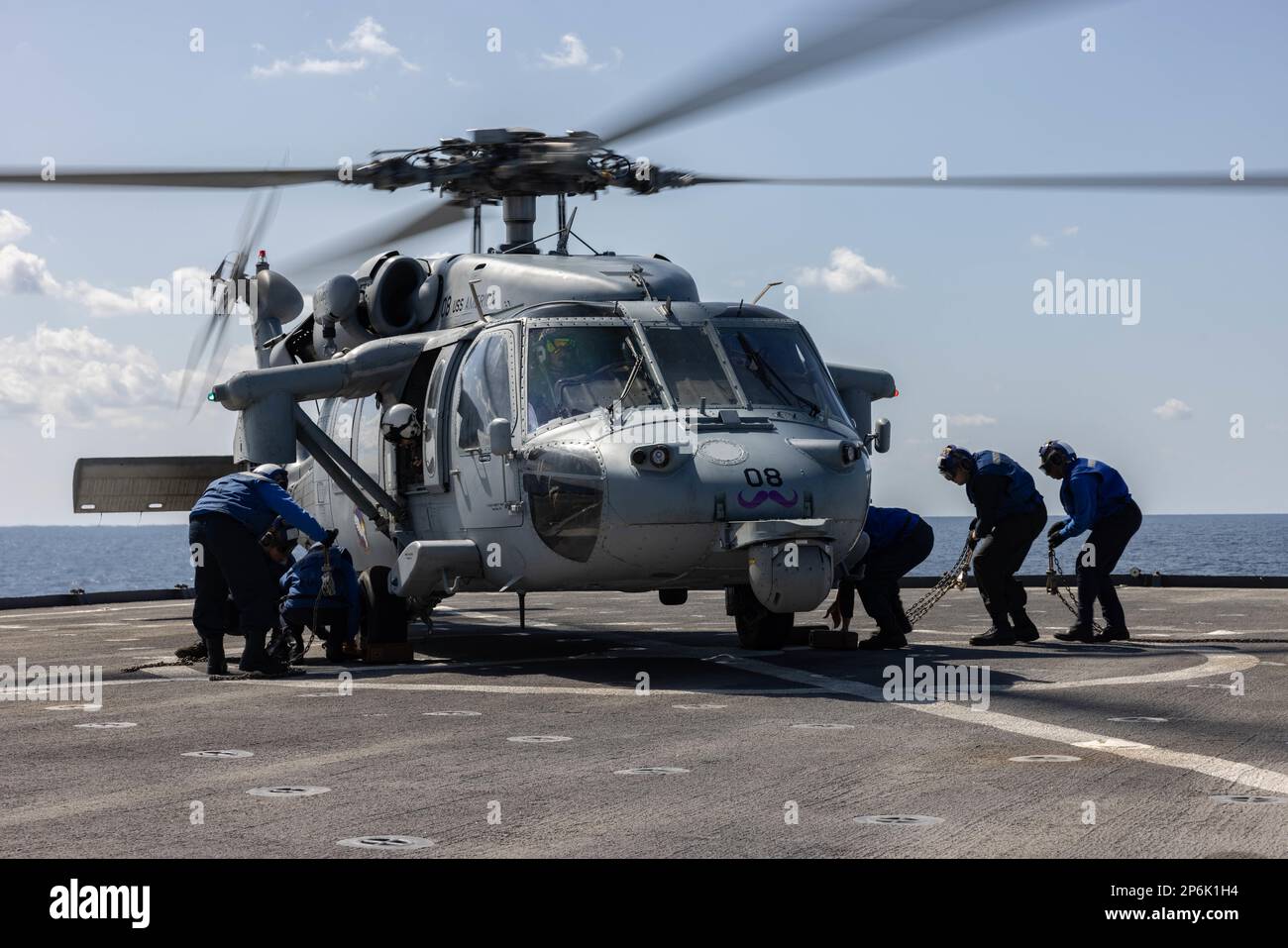 U.S. Navy Sailors aboard the amphibious dock landing ship USS Ashland ...