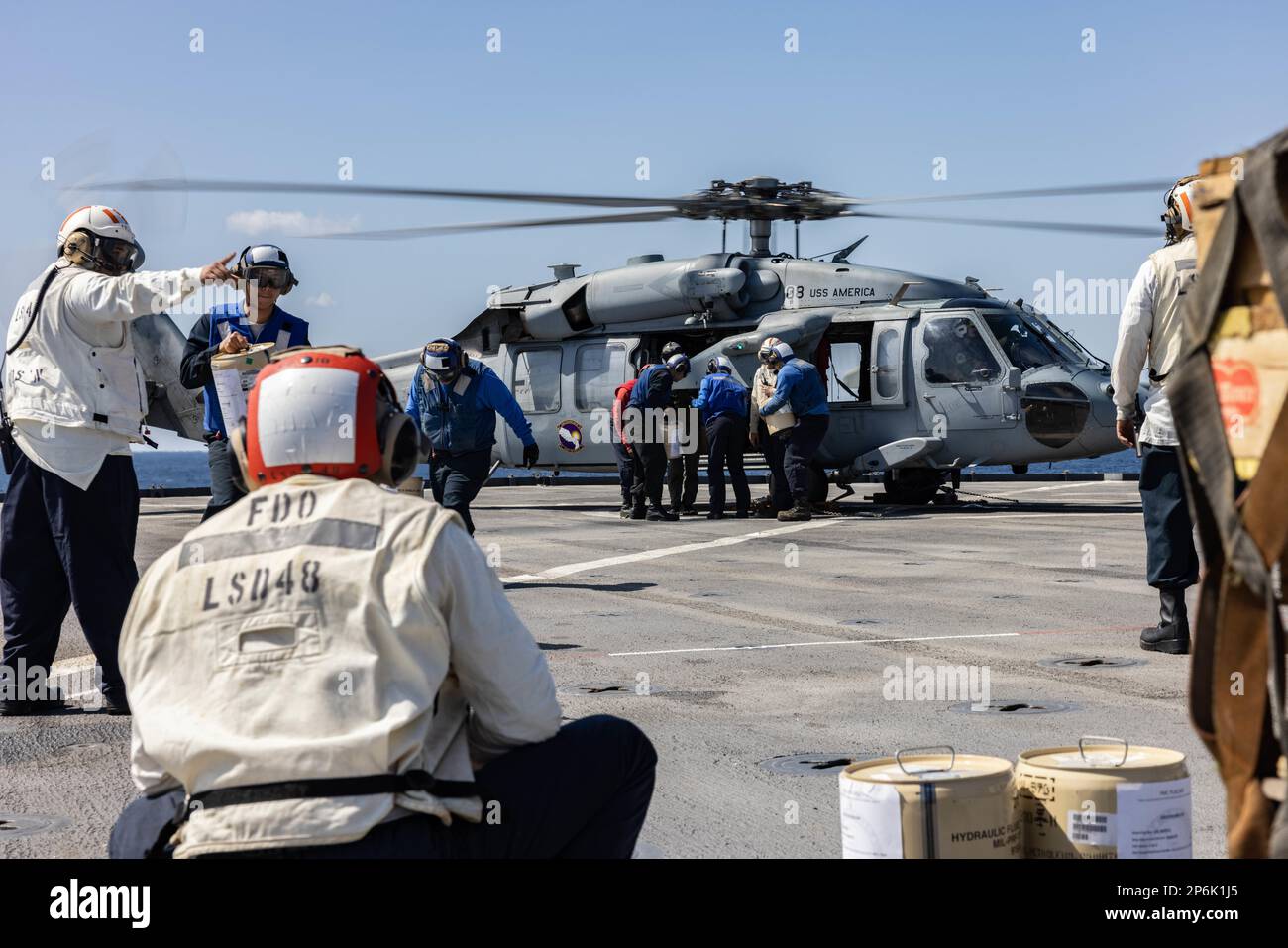 U.S. Navy Sailors aboard the amphibious dock landing ship USS Ashland ...