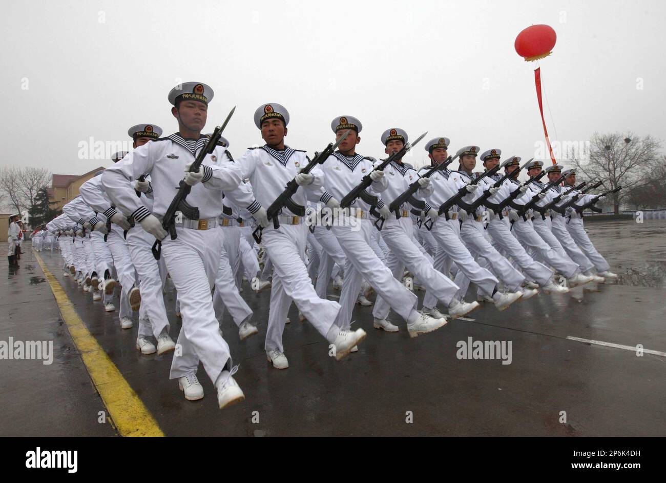 New navy soldiers march during a parade at a training base of China's ...