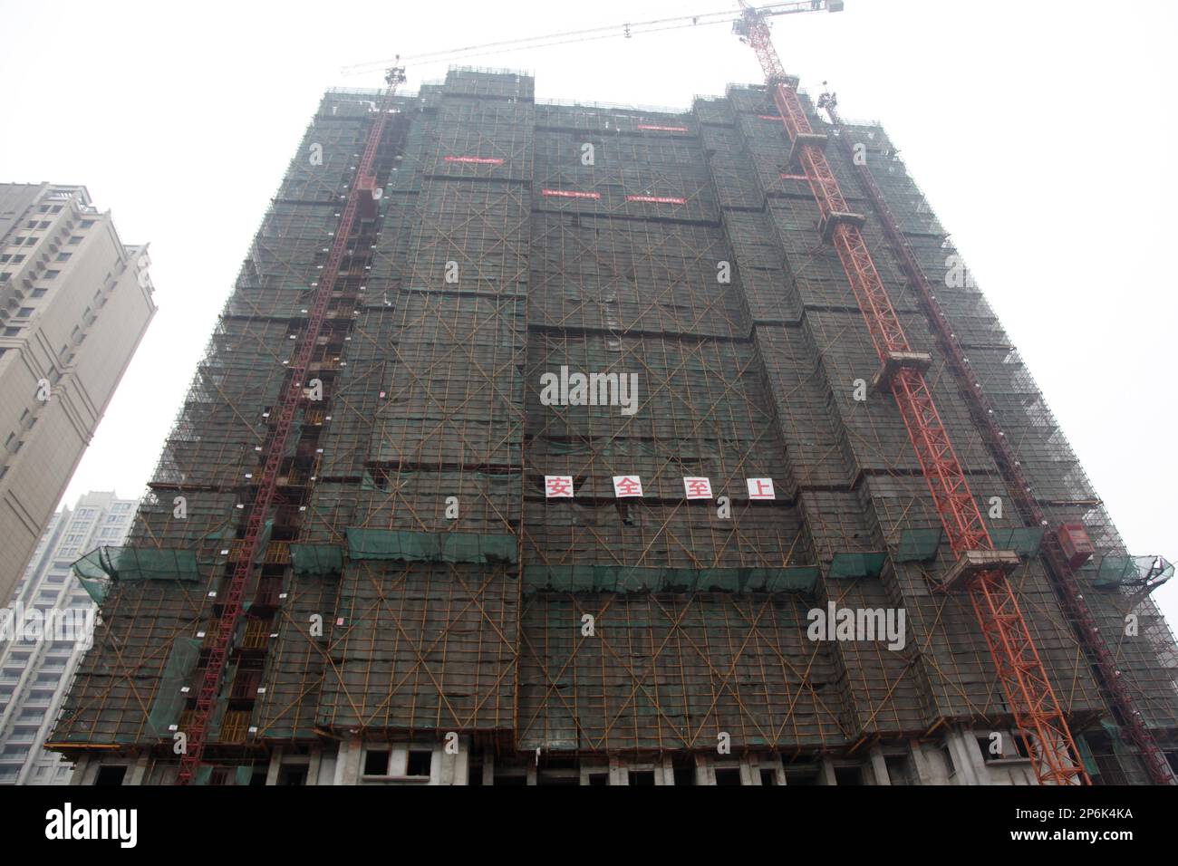 A 30-floor-hight building shaded the sunshine of a residential building ...