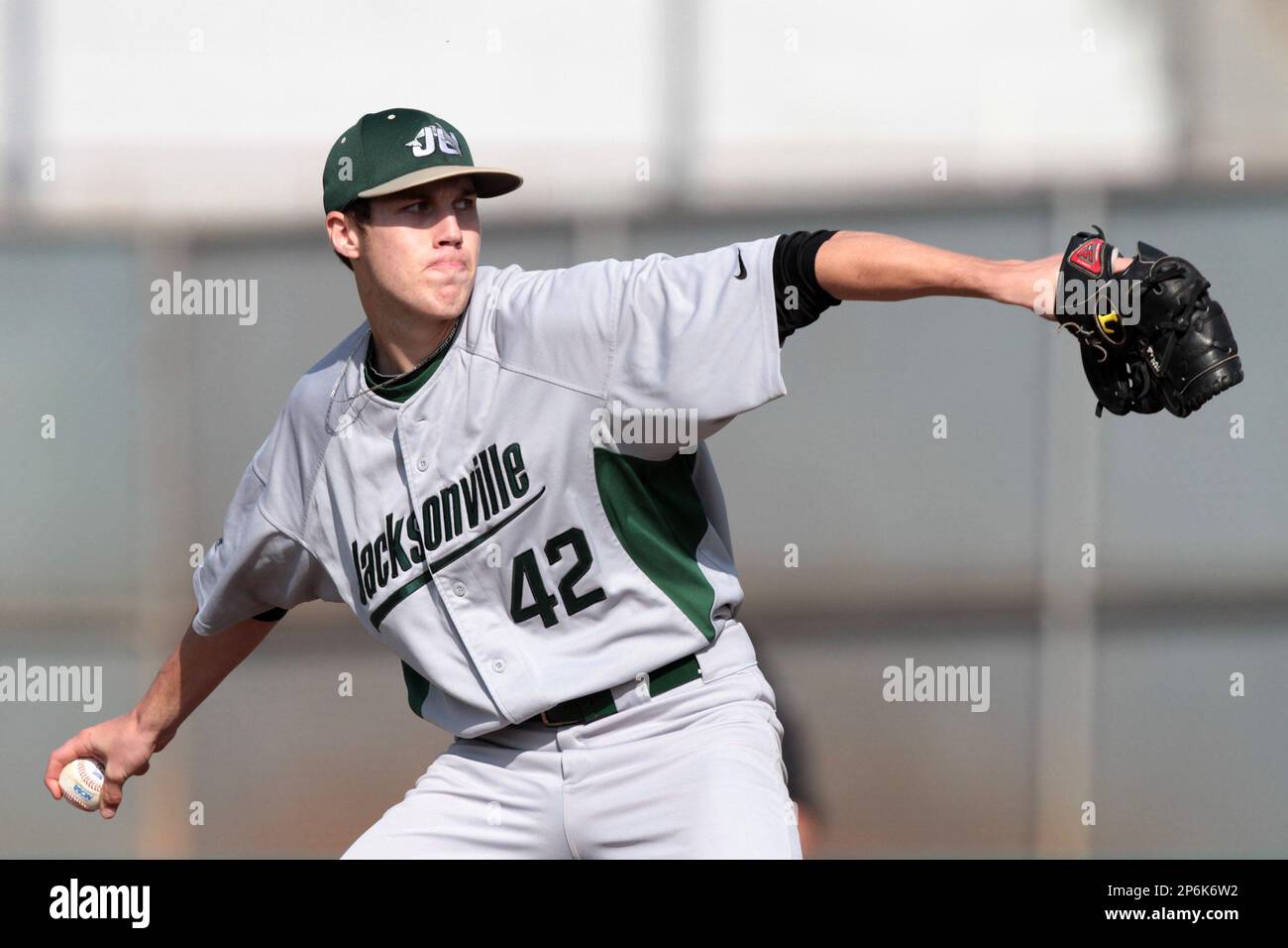 Alex McRae (42) of the Jacksonville Dolphins pitches against the USC ...