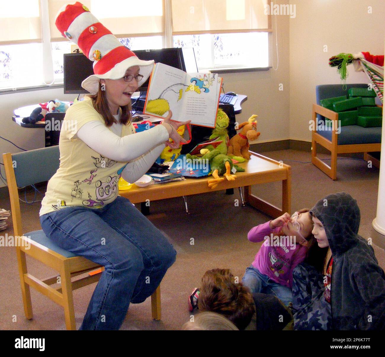 Kiwanis representative Megan Gilson reads on Saturday, March 3, 2012 ...