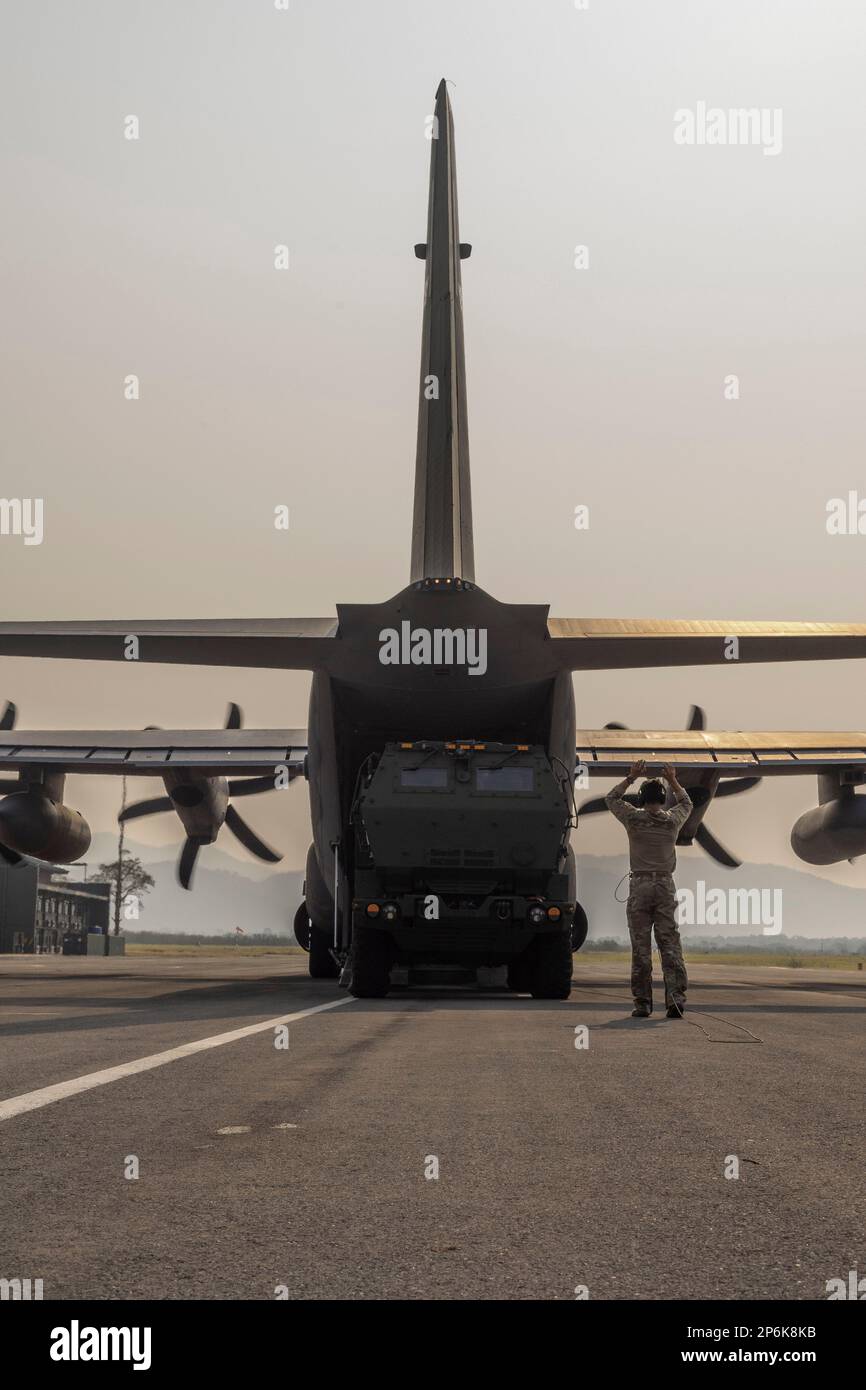 A U.S. Airman with 353 Special Operations Wing, guides a U.S. Marine ...