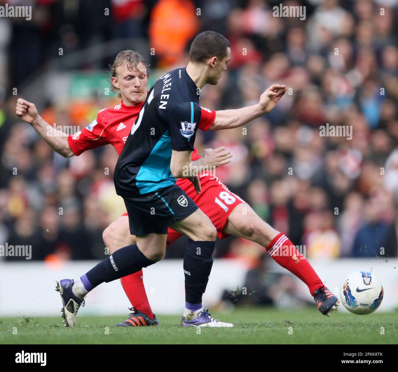Liverpools Dirk Kuyt tussles with Arsenals Thomas Vermaelen..Liverpool ...