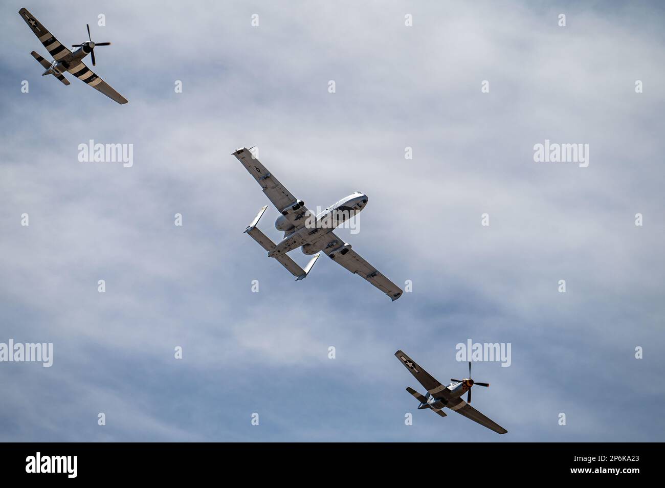 A U.S. Air Force A-10C Thunderbolt II flies alongside two P-51 Mustangs ...
