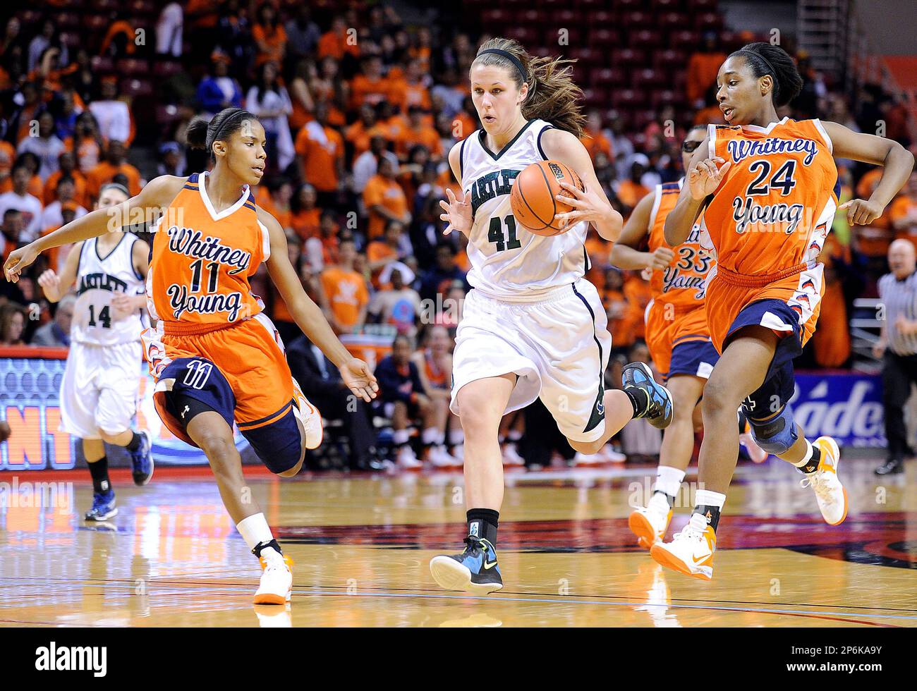 Whitney Young's Janee Thompson, left, and Tanita Allen, right, race to ...