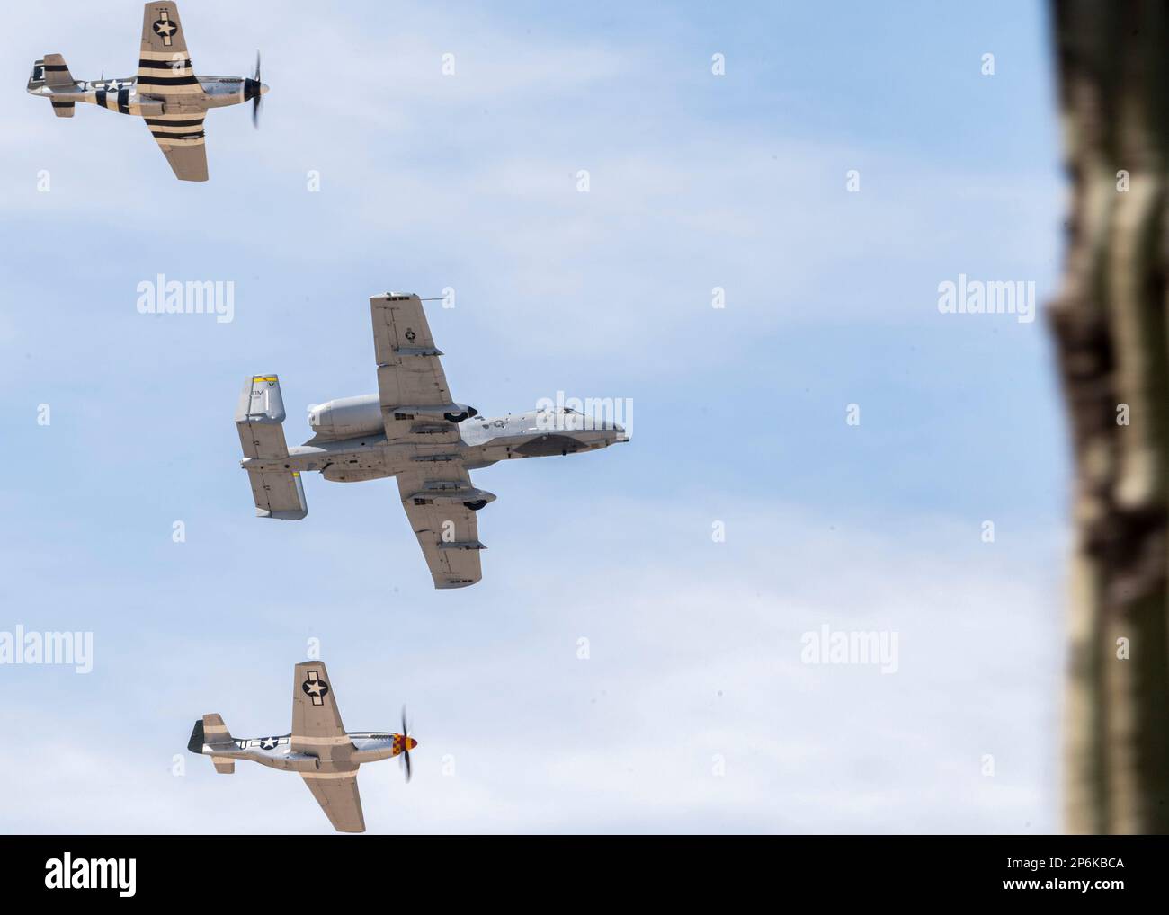 A U.S. Air Force A-10C Thunderbolt II flies alongside two P-51 Mustangs ...