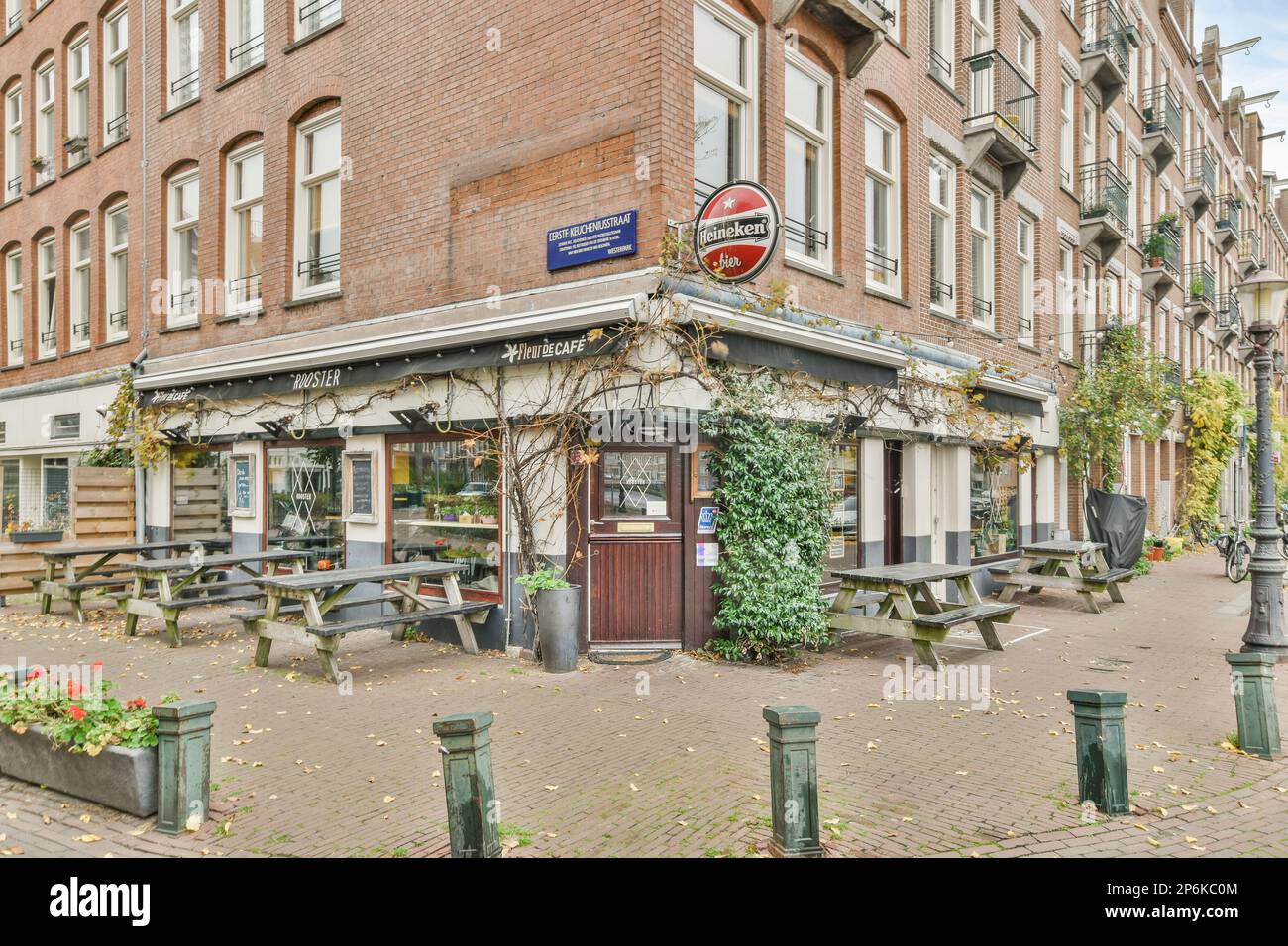 Amsterdam, Netherlands - 10 April, 2021: a street corner with tables ...