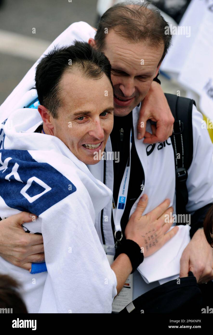 Viktor Rothlin of Switzerland, left, celebrates with a supporter after ...