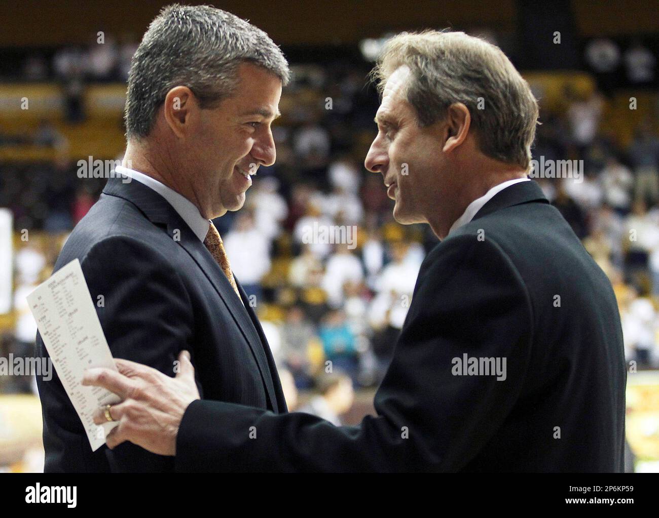 Boise State coach Leon Rice, left, is greeted by Wyoming coach Larry ...