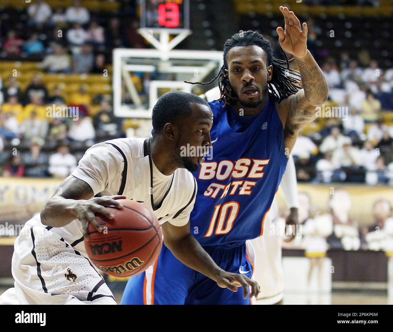 Wyoming guard JayDee Luster, left, drives against Boise State's Te ...