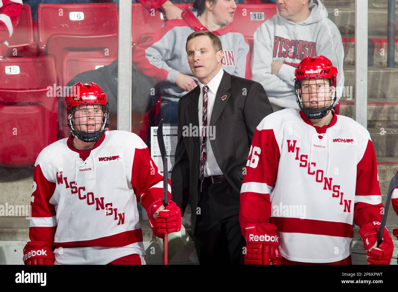 Wisconsin Badgers Head Coach Mike Eeaves looks on during a WCHA ...