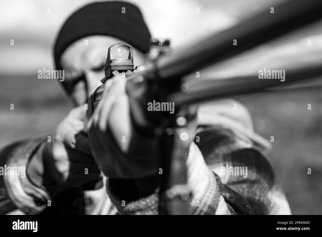 Hunter Target with laser sight. Collimating sight. Hunter with shotgun ...