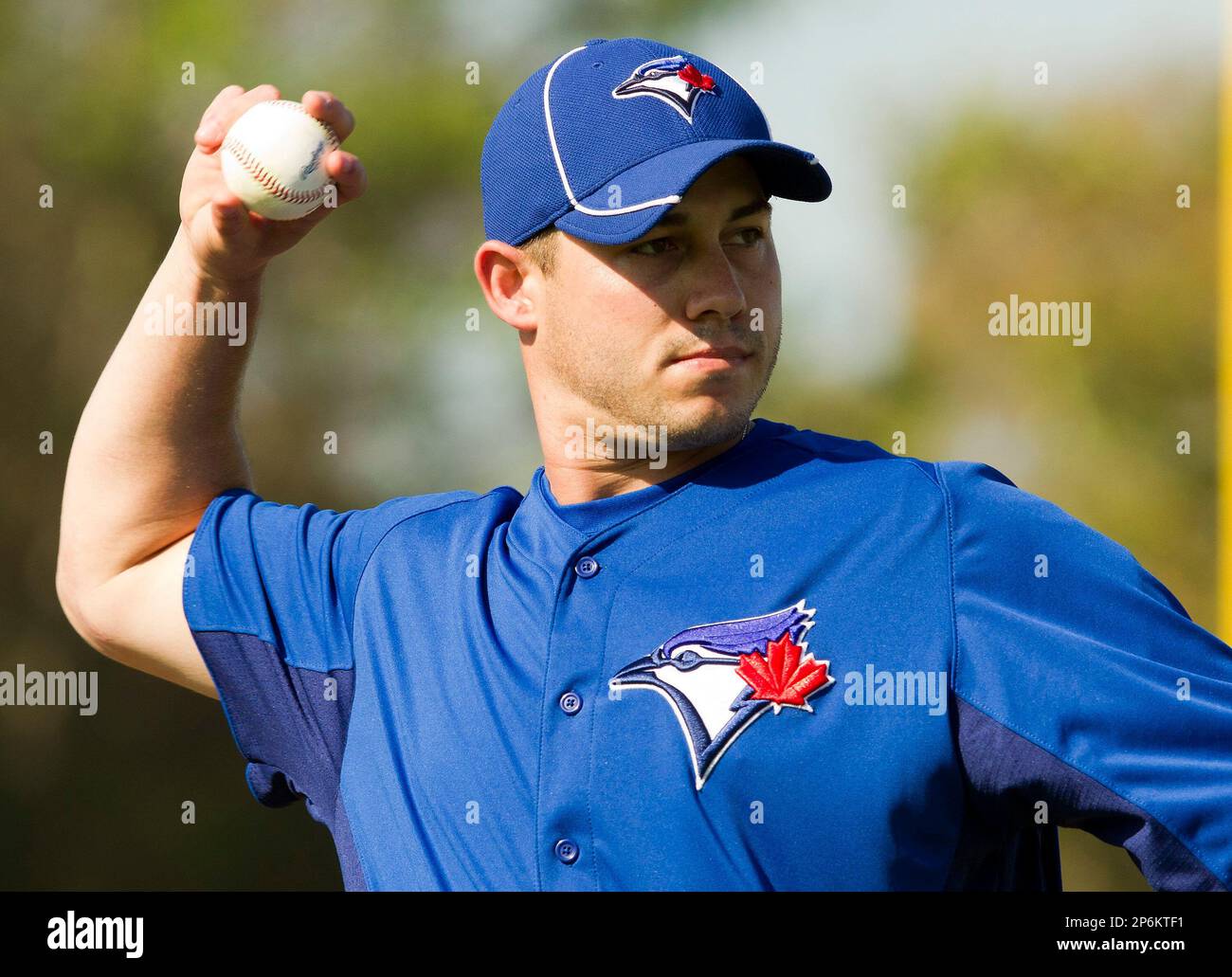 Toronto Blue Jays pitcher Dustin McGowan throws to first base at spring ...
