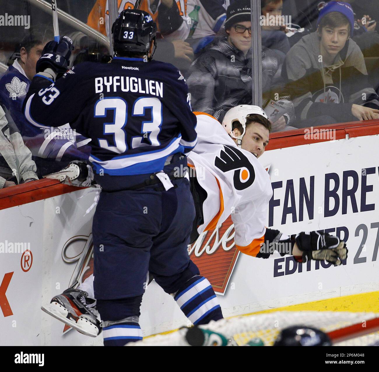 Winnipeg Jets' Dustin Byfuglien (33) crushes Philadelphia Flyers' Zac ...