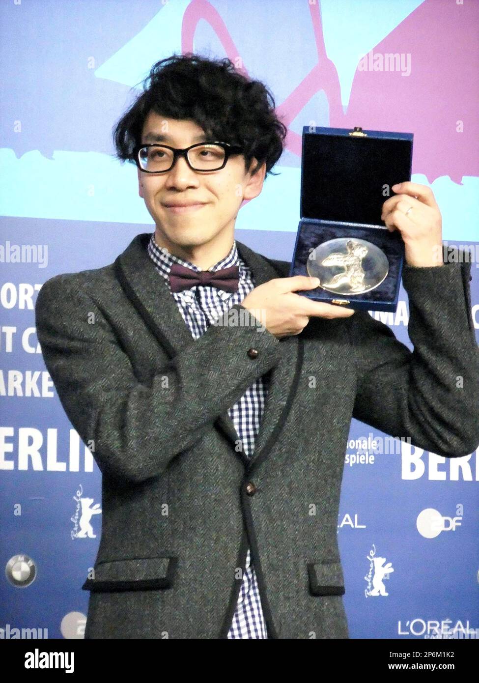 Director Atsushi Wada poses with his Silver Bear for his short film, " The Great Rabbit, '' at ...