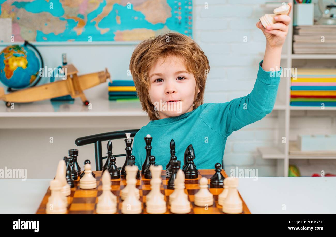 Thinking child. Little boy playing chess. Concentrated boy developing ...