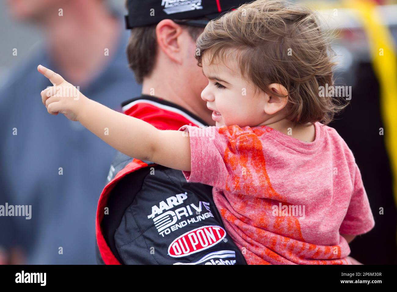 DAYTONA,FL - FEB 19, 2012: Leo Benjamin Gordon stands with his dad Jeff ...