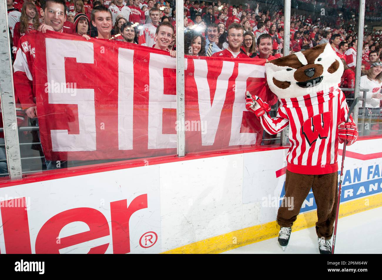 Wisconsin Badgers Mascot Bucky Badger poses with fans during a WCHA ...