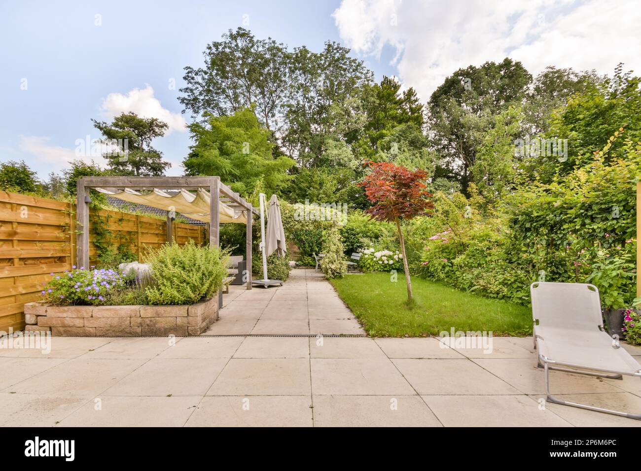 Amsterdam, Netherlands - 10 April, 2021: a backyard with lots of plants ...