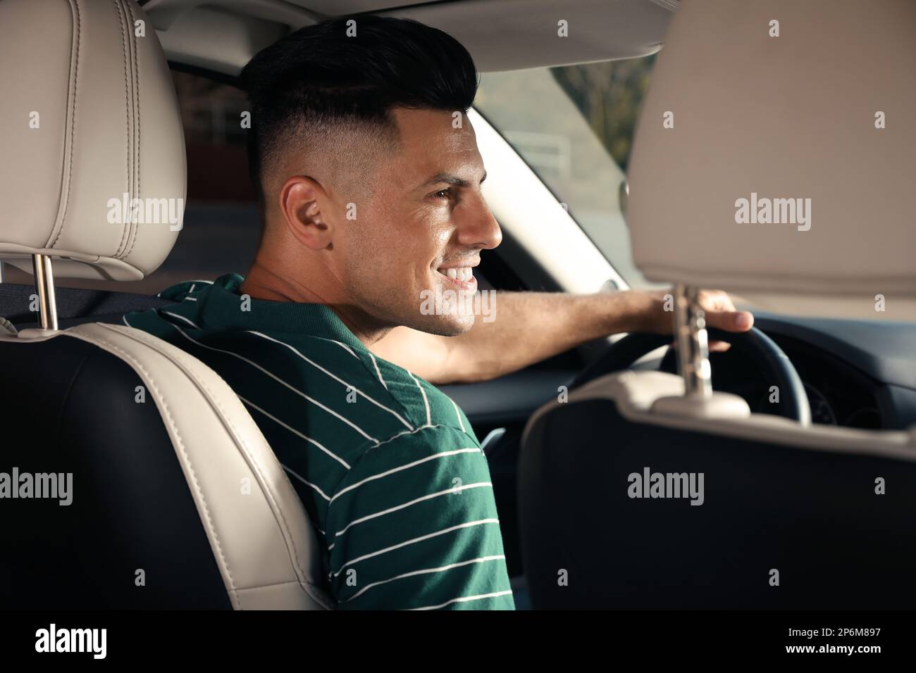 Handsome chauffeur steering wheel hi-res stock photography and images ...