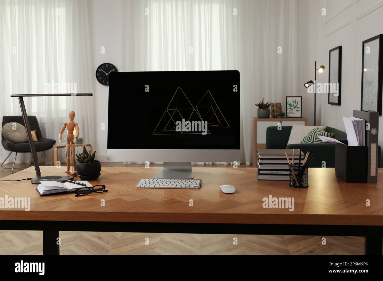 Workplace with computer on wooden desk in light room. Modern interior ...