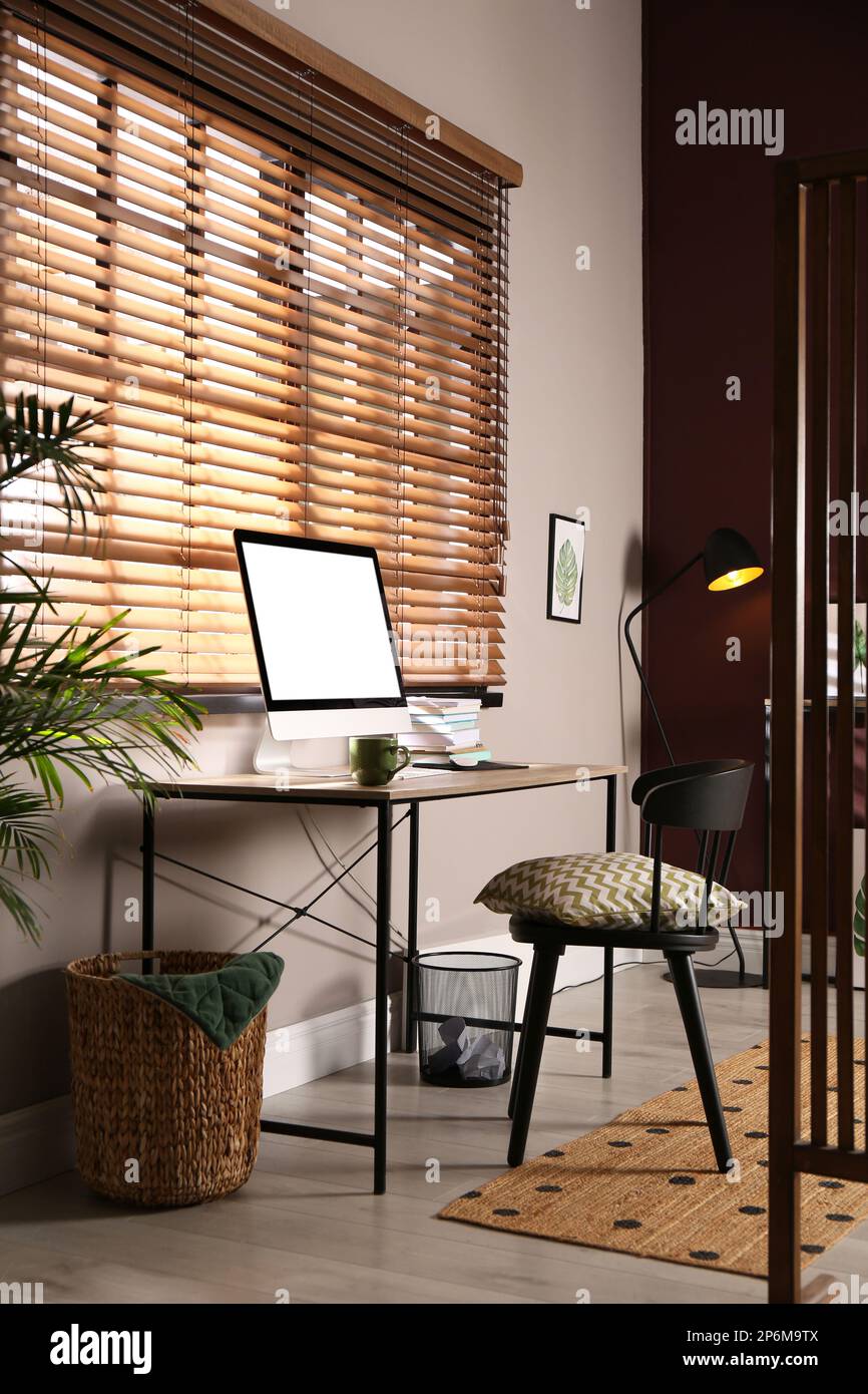 Comfortable workplace with modern computer and stylish furniture in ...