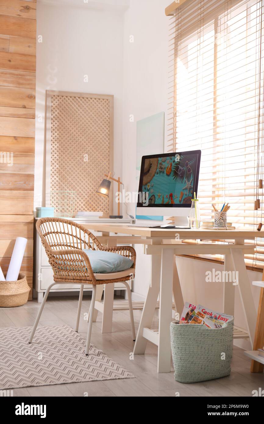 Comfortable workplace with modern computer near window. Interior design ...