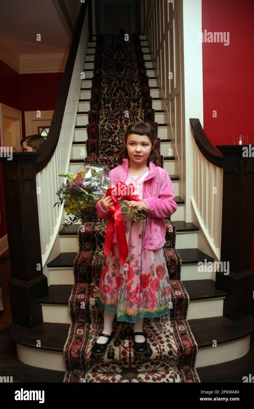 Six-year-old Lucy Lande waits for the arrival of China's vice president ...