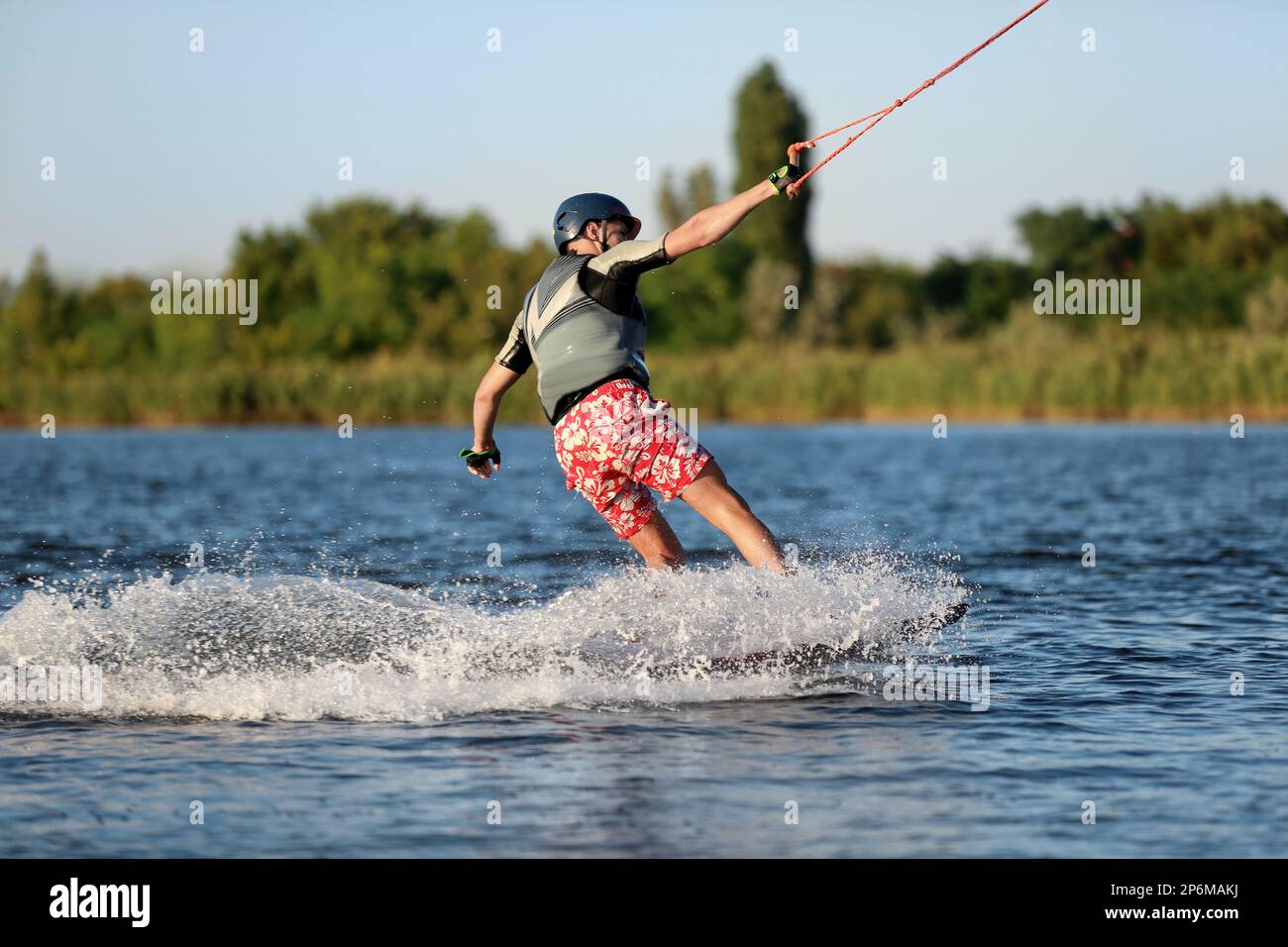 Teenage boy wakeboarding on river. Extreme water sport Stock Photo - Alamy