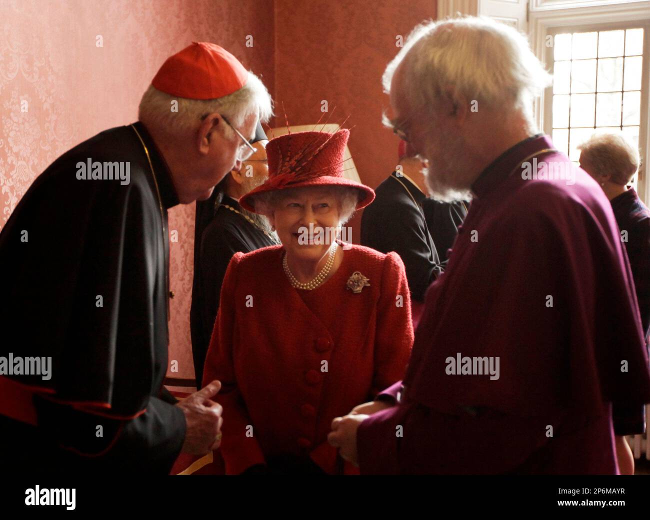 Britain's Queen Elizabeth II, center, speaks with the Archbishop of ...