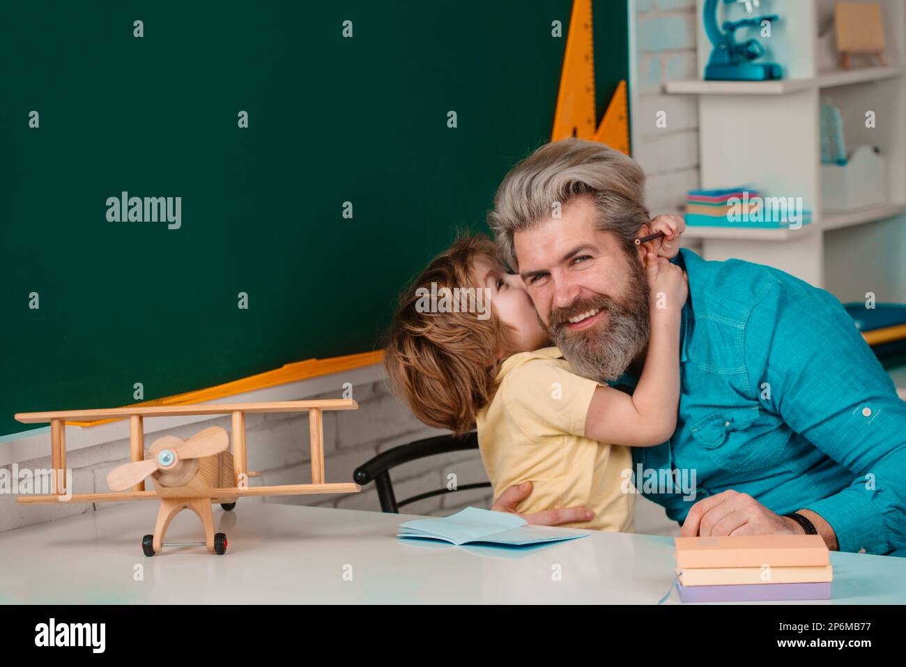 Elementary school tutorship. Afterschool tutoring. Happy school kids at ...