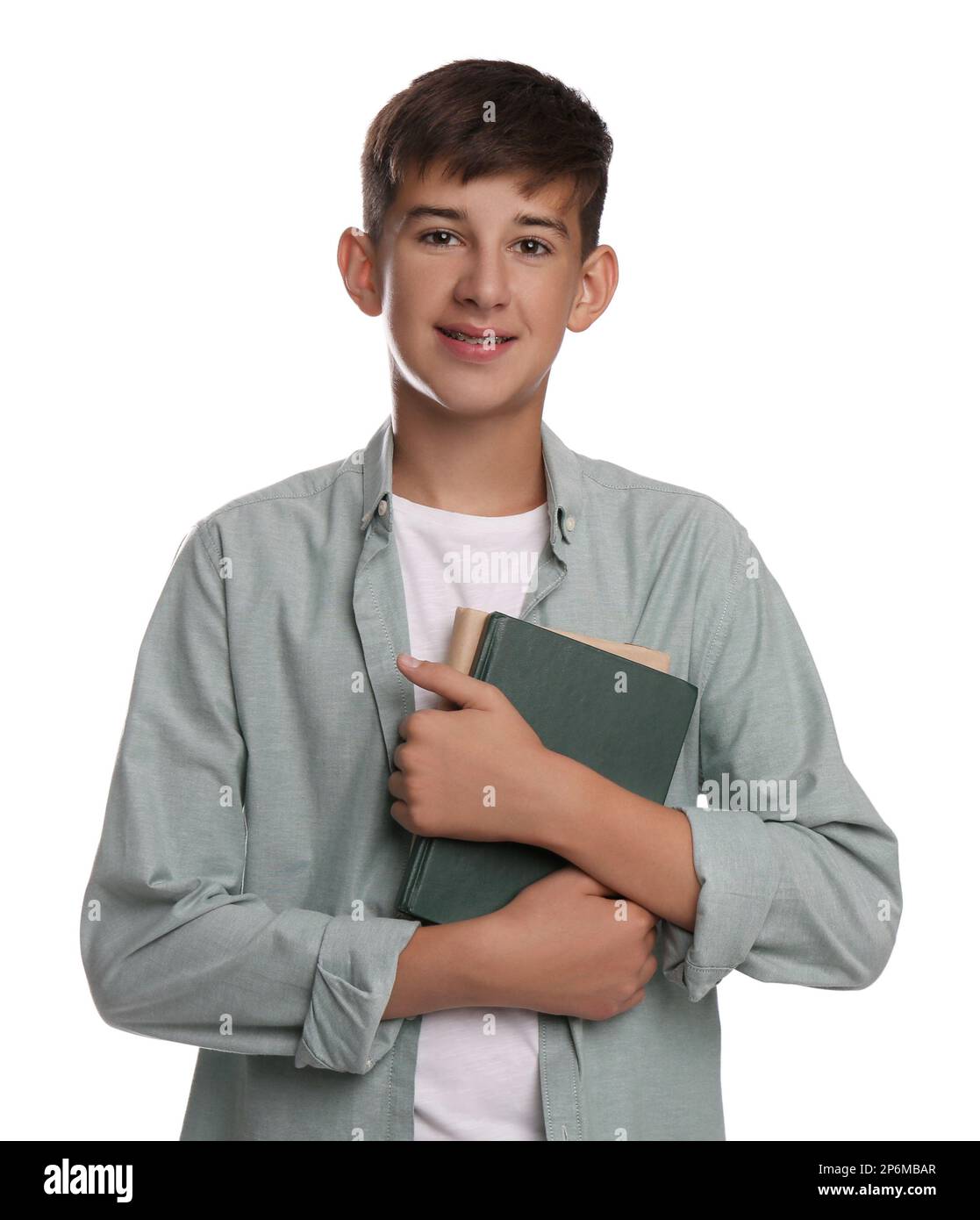 Teenage student holding books on white background Stock Photo - Alamy