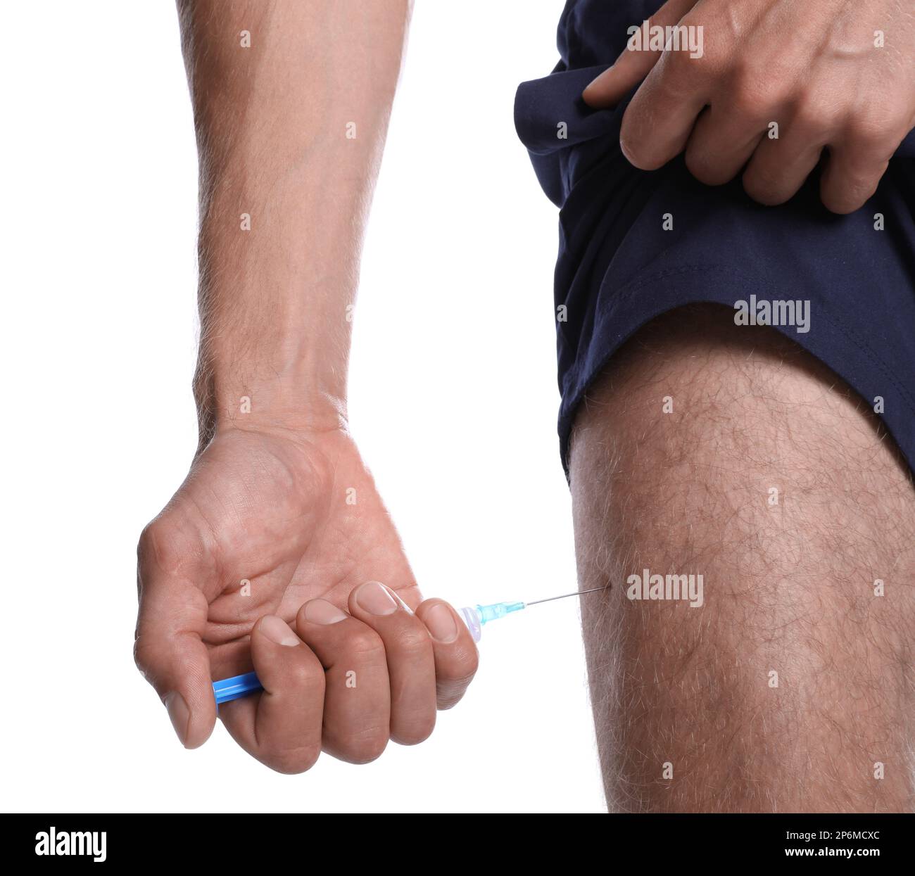 Athletic man injecting himself on white background, closeup. Doping ...