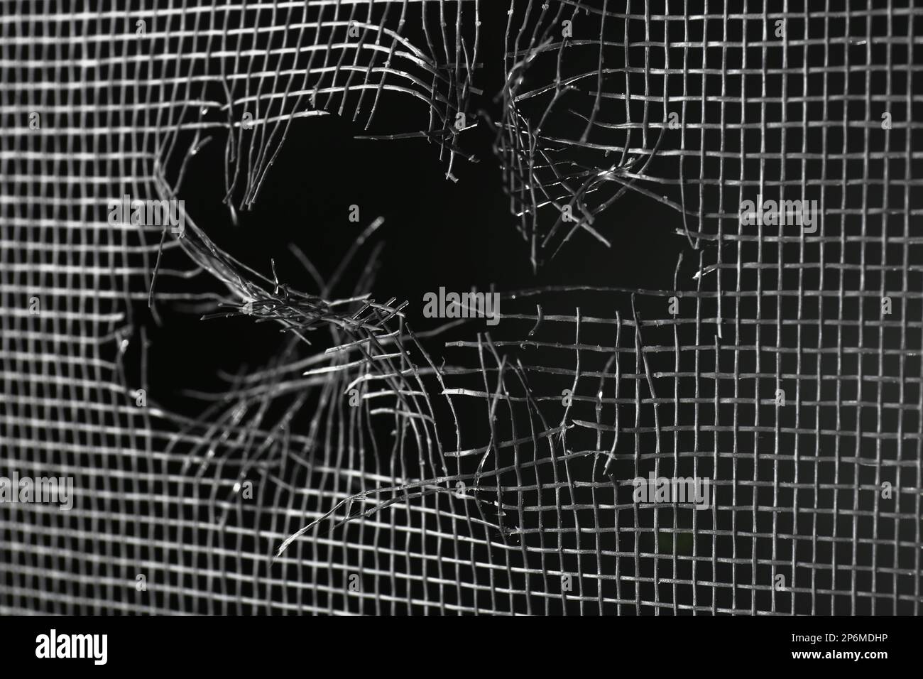 Torn window screen against black background, closeup Stock Photo - Alamy