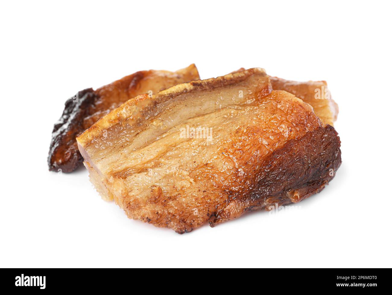 Tasty fried cracklings on white background. Cooked pork lard Stock ...