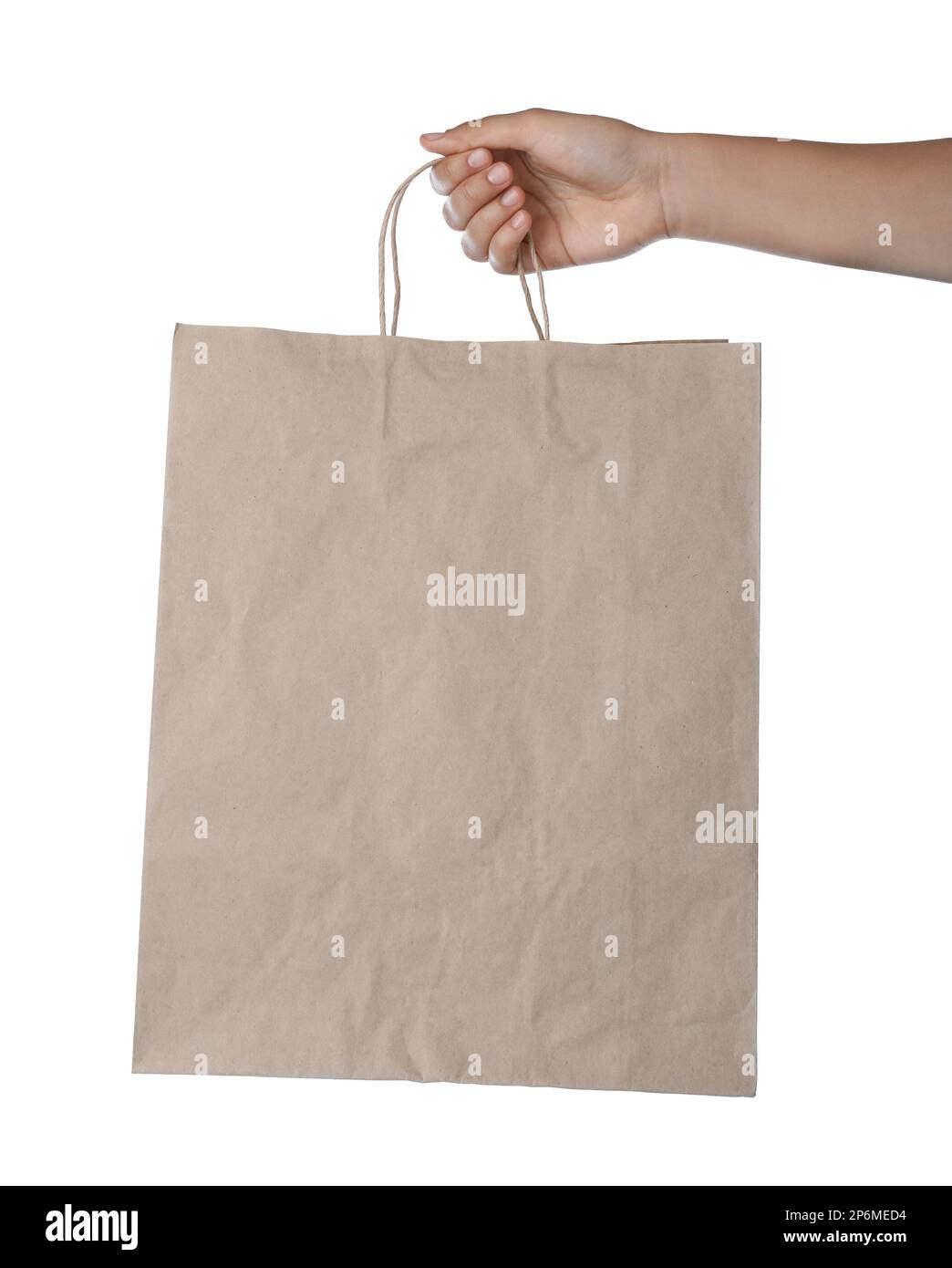 Woman holding shopping paper bag on white background Stock Photo - Alamy