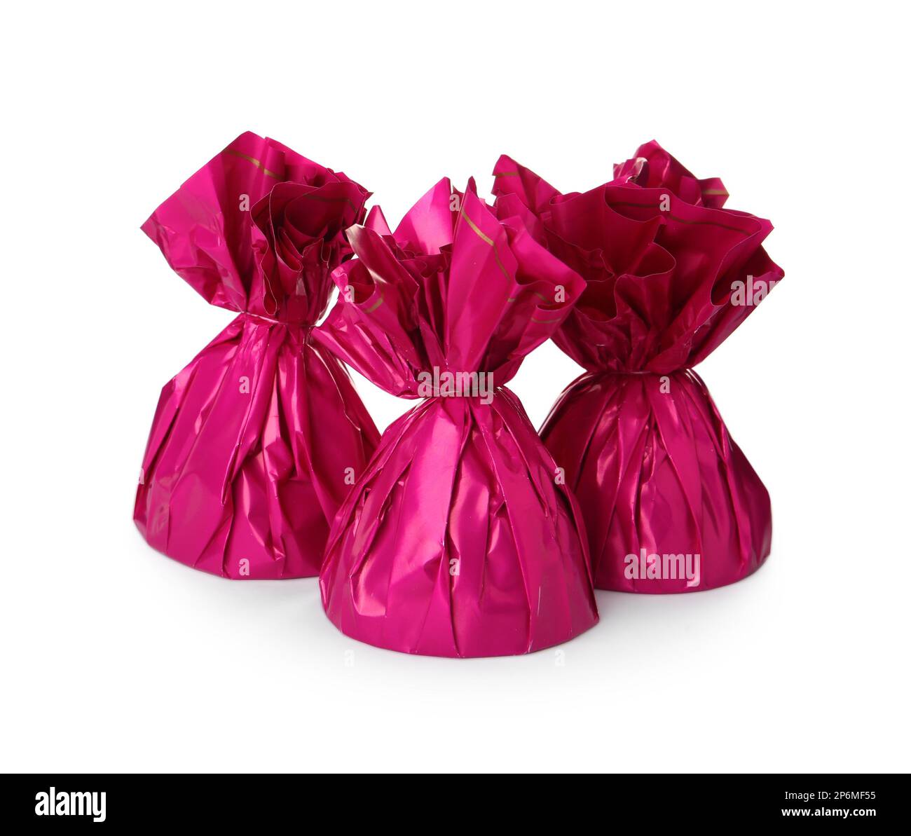 Delicious candies in pink wrappers on white background Stock Photo - Alamy