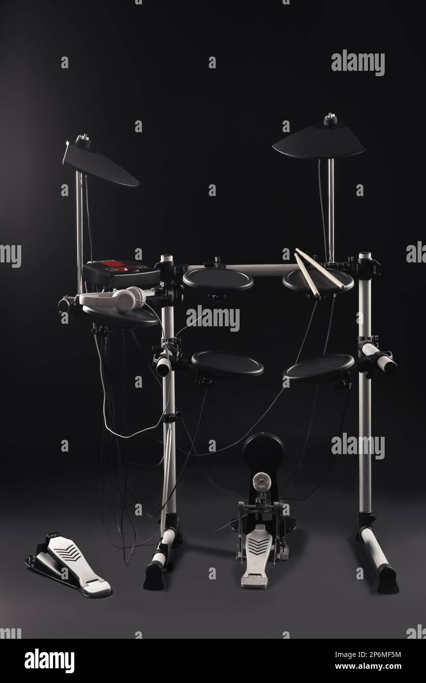 Modern electronic drum kit on dark background. Musical instrument Stock ...