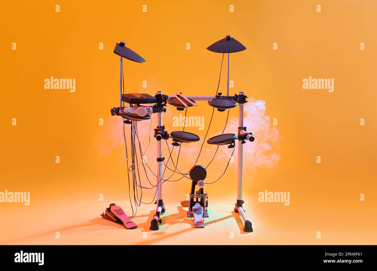 Modern electronic drum kit and smoke on yellow background. Musical ...