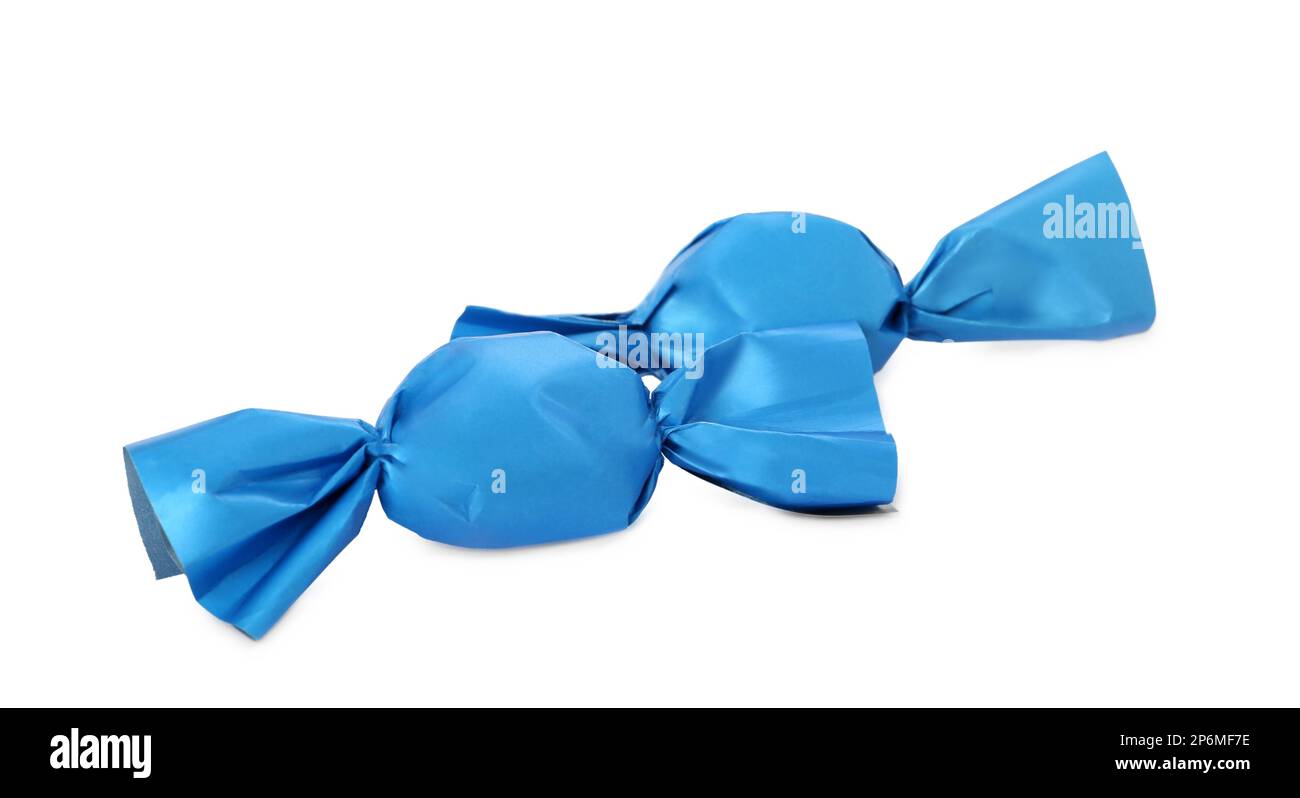 Delicious candies in light blue wrappers on white background Stock ...