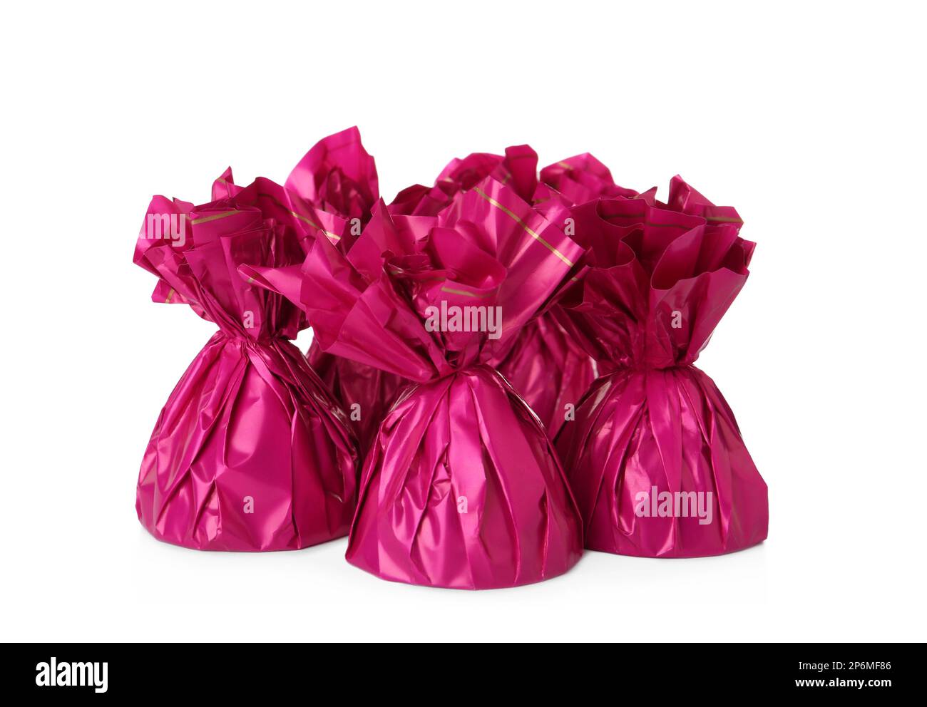Delicious candies in pink wrappers on white background Stock Photo - Alamy