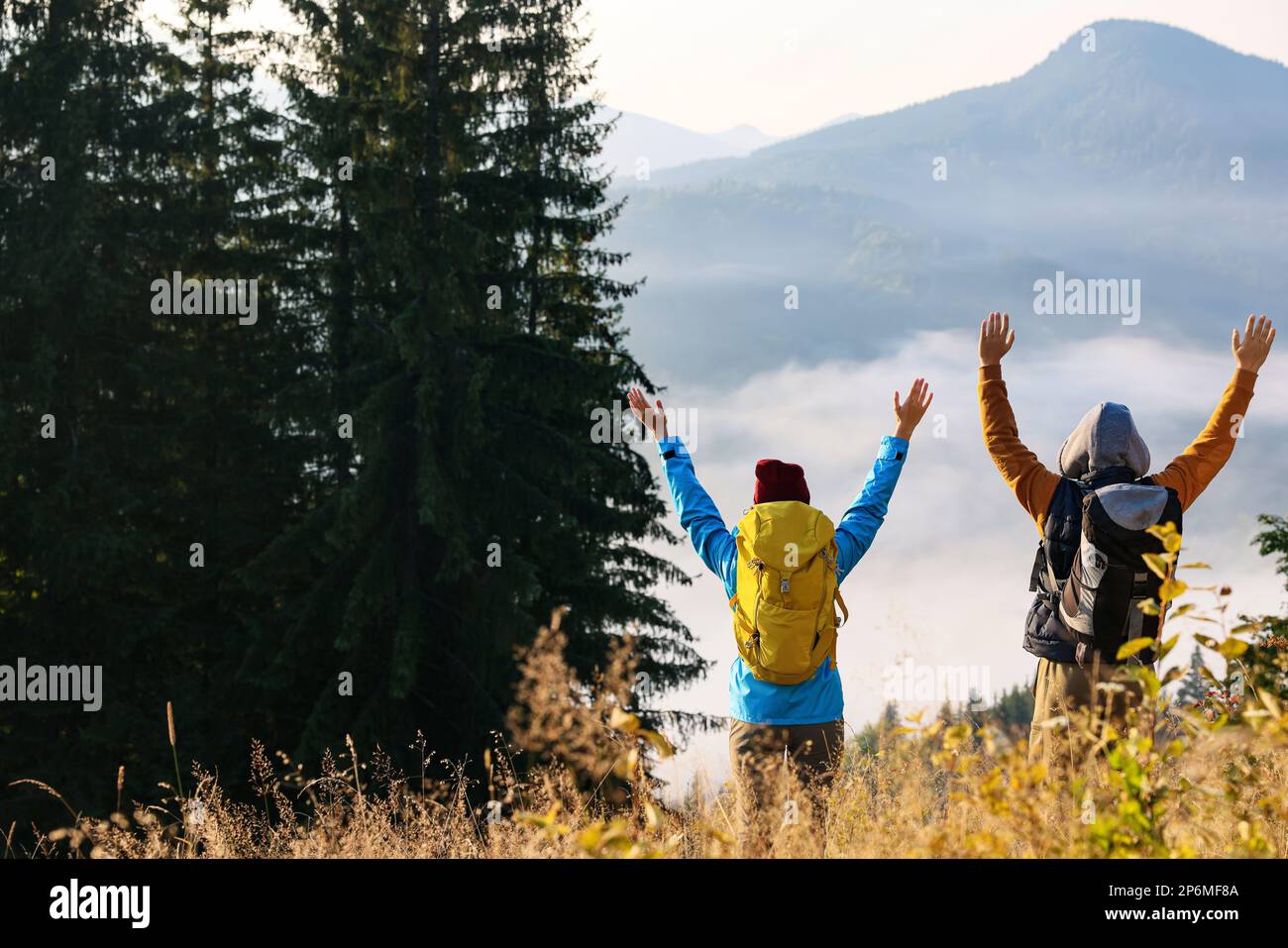 Back view couple backpacking in hi-res stock photography and images - Alamy