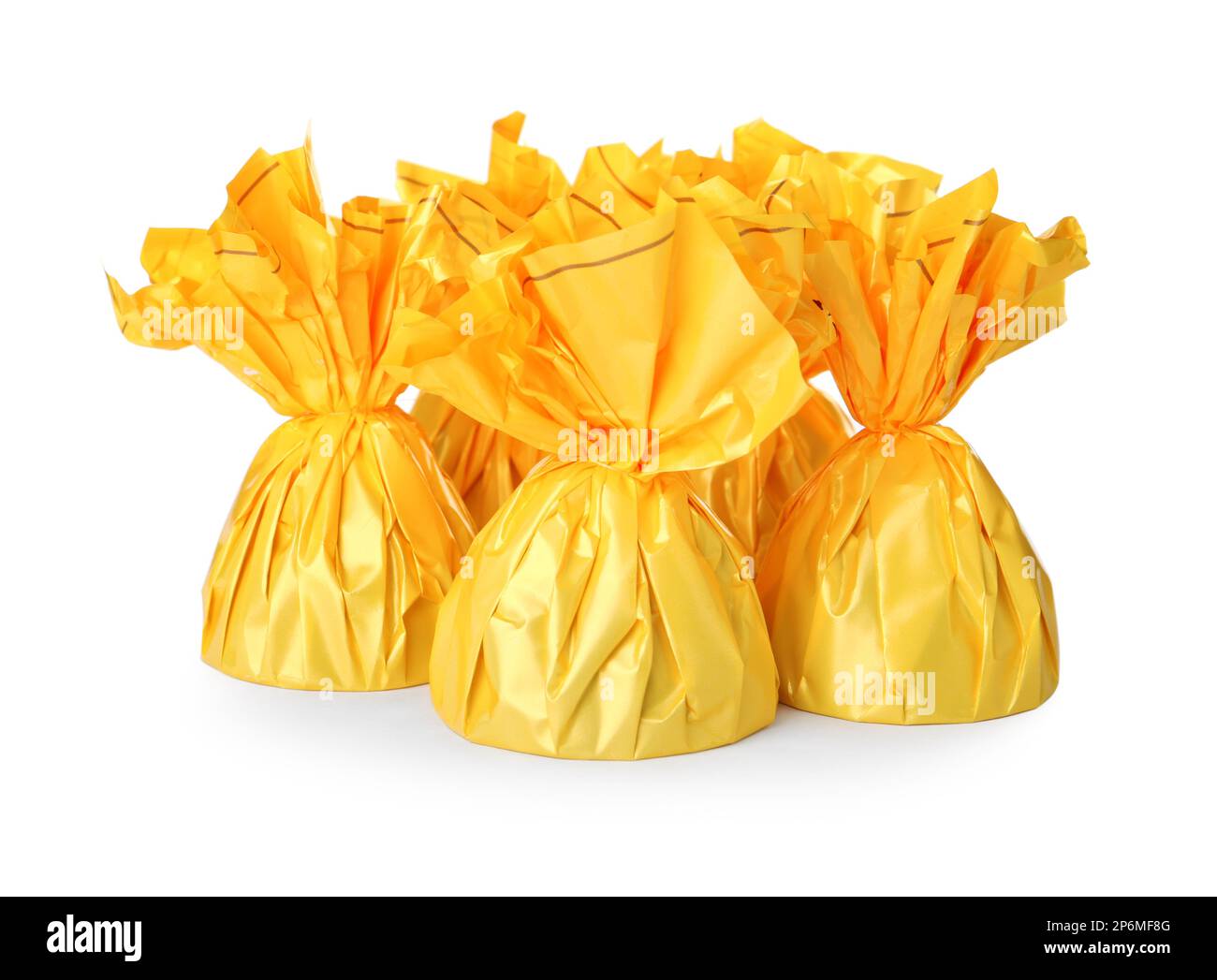 Delicious candies in yellow wrappers on white background Stock Photo ...