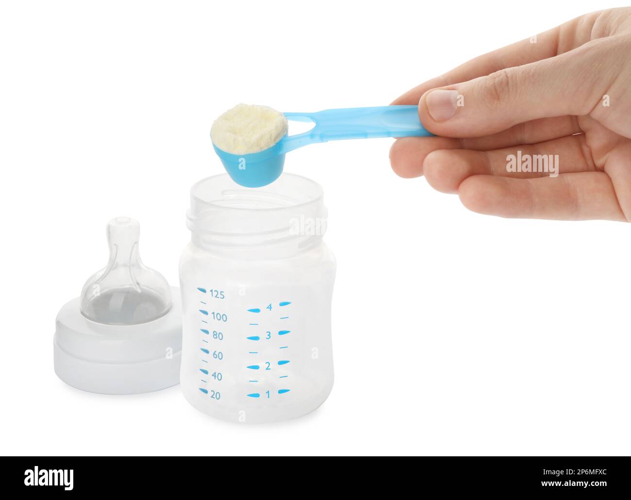 Woman preparing infant formula on white background, closeup. Baby milk ...