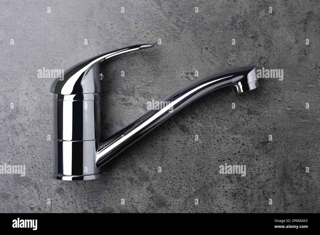 Single handle water tap on grey table, top view Stock Photo - Alamy