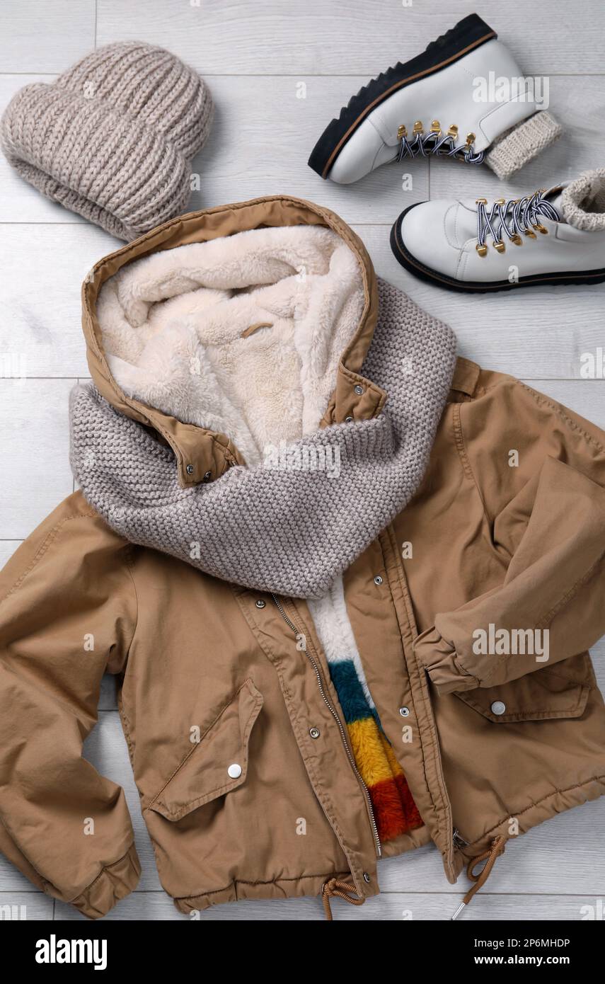 Winter fashion. Layout with women's outfit on white wooden background ...
